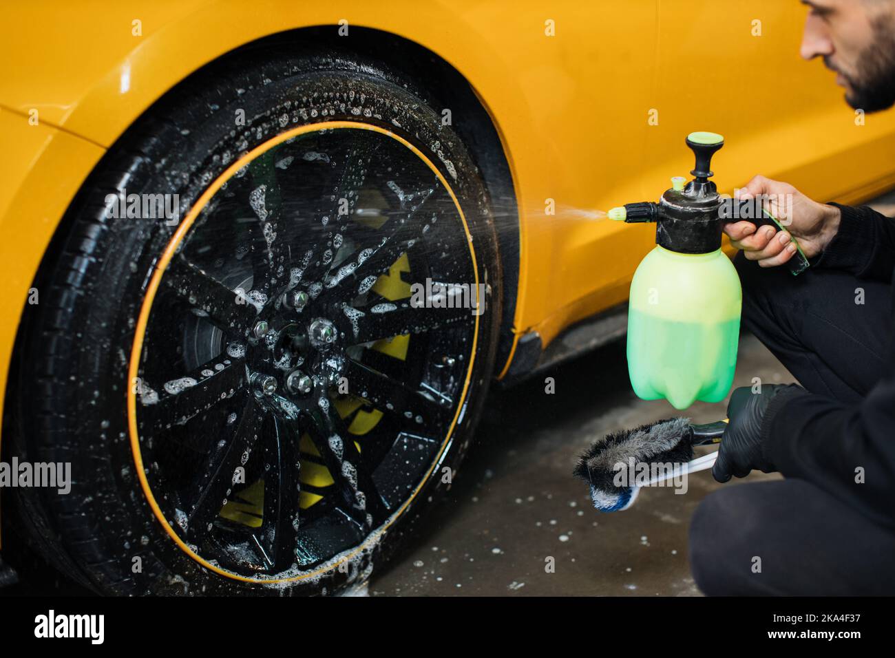 Car rims cleaning, car detailing wash concept. Cropped close up photo ...