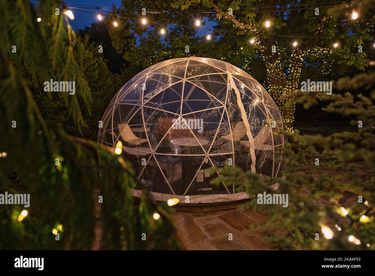 Igloo restaurant in a garden setting Stock Photo - Alamy