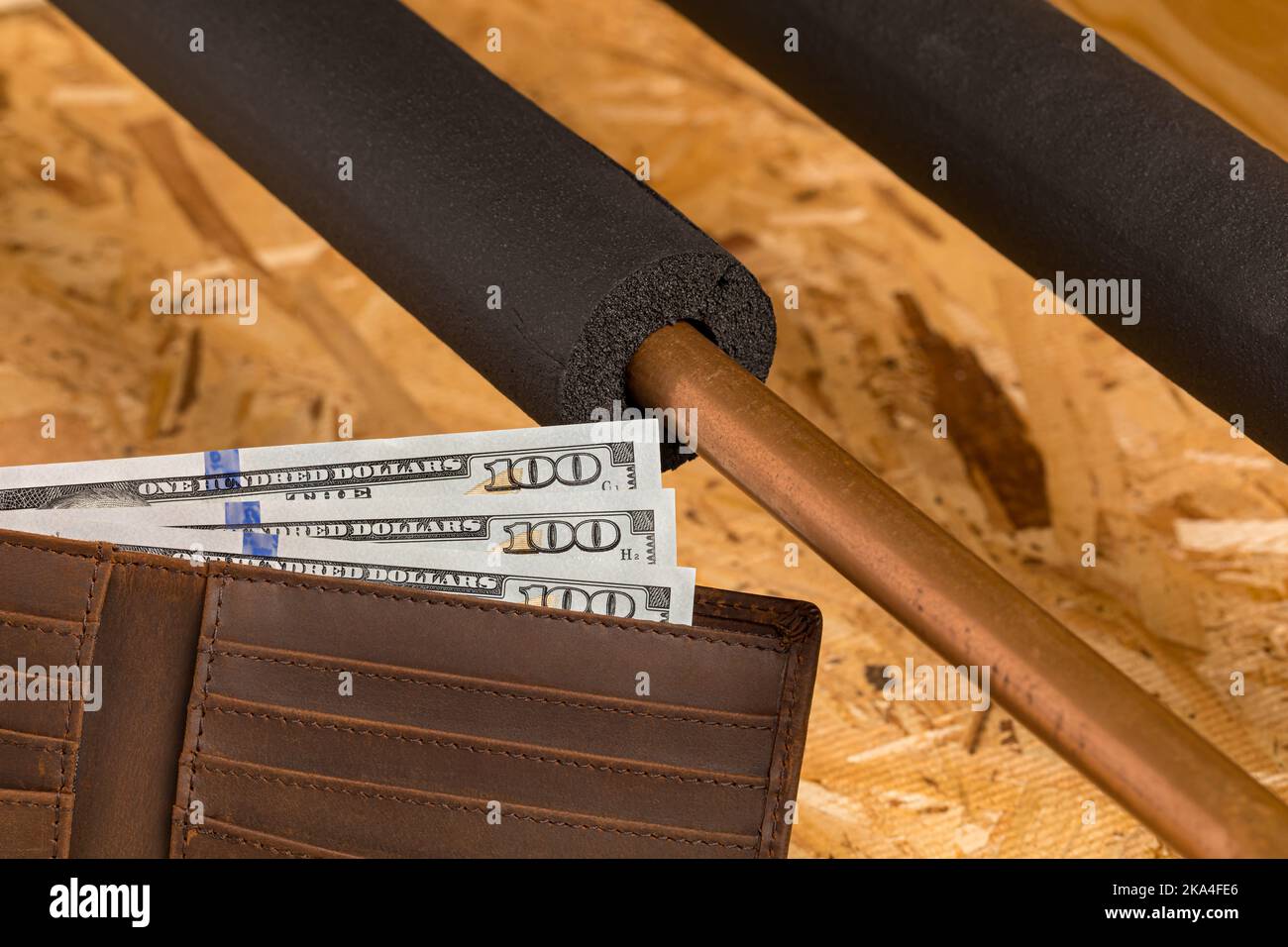 Water pipe with insulation and cash money in house. Plumbing freezing ...