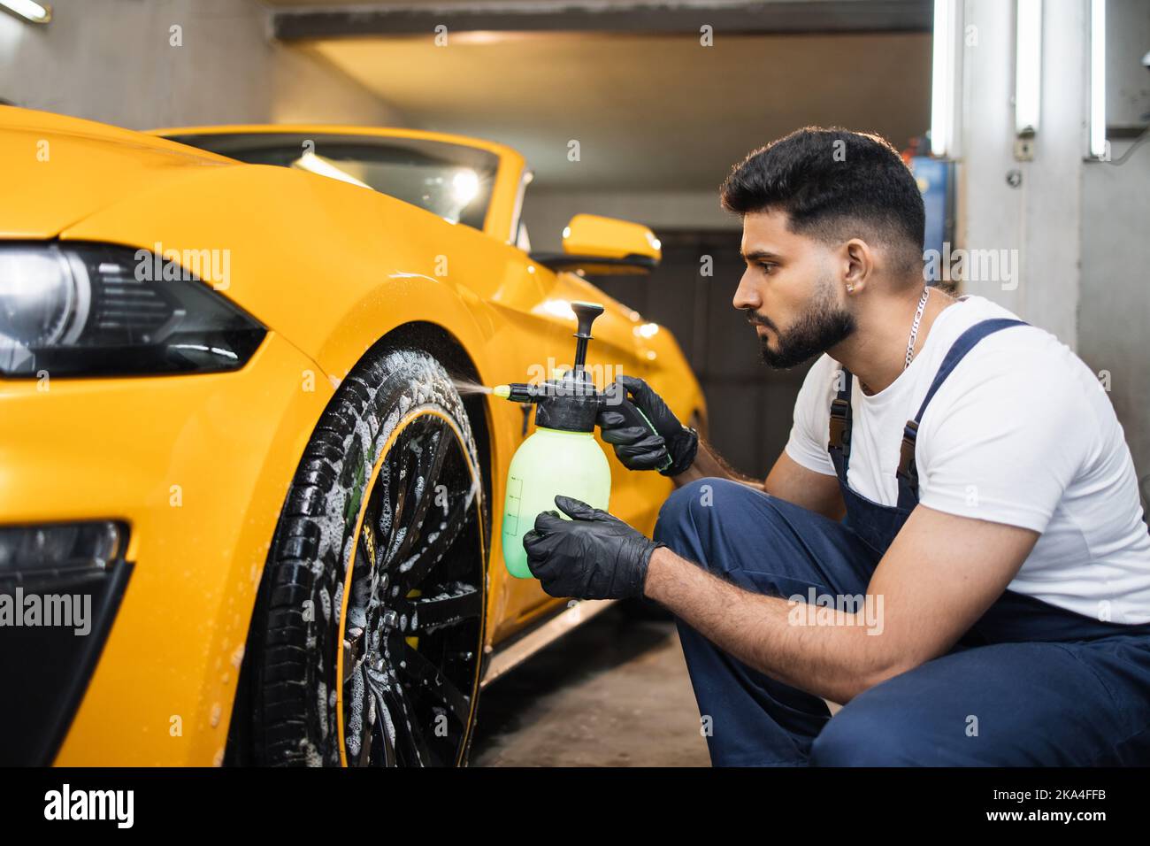 Washing the car with sponge water gun hi-res stock photography and ...