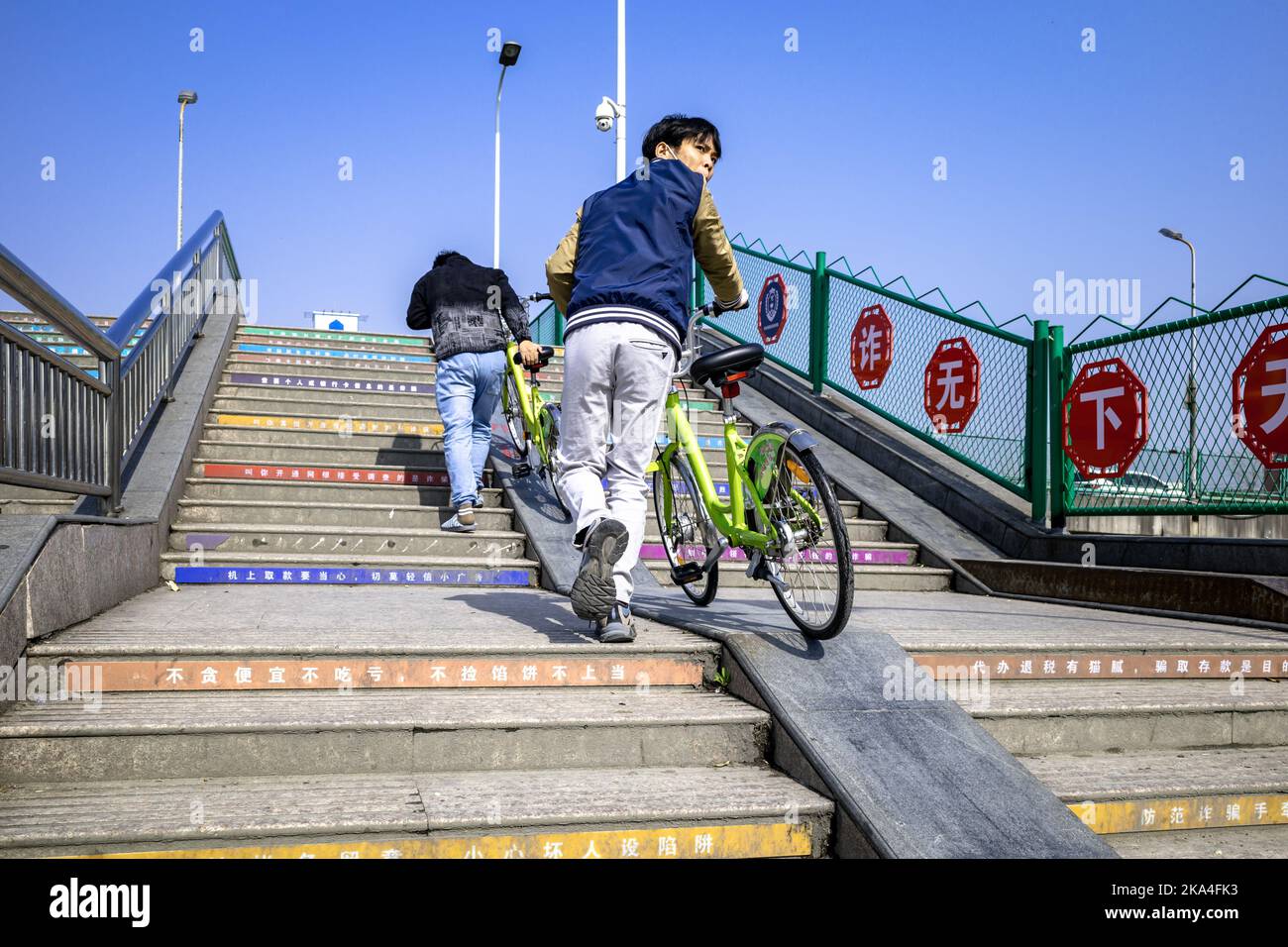 Two men climbing ladder hi-res stock photography and images - Alamy