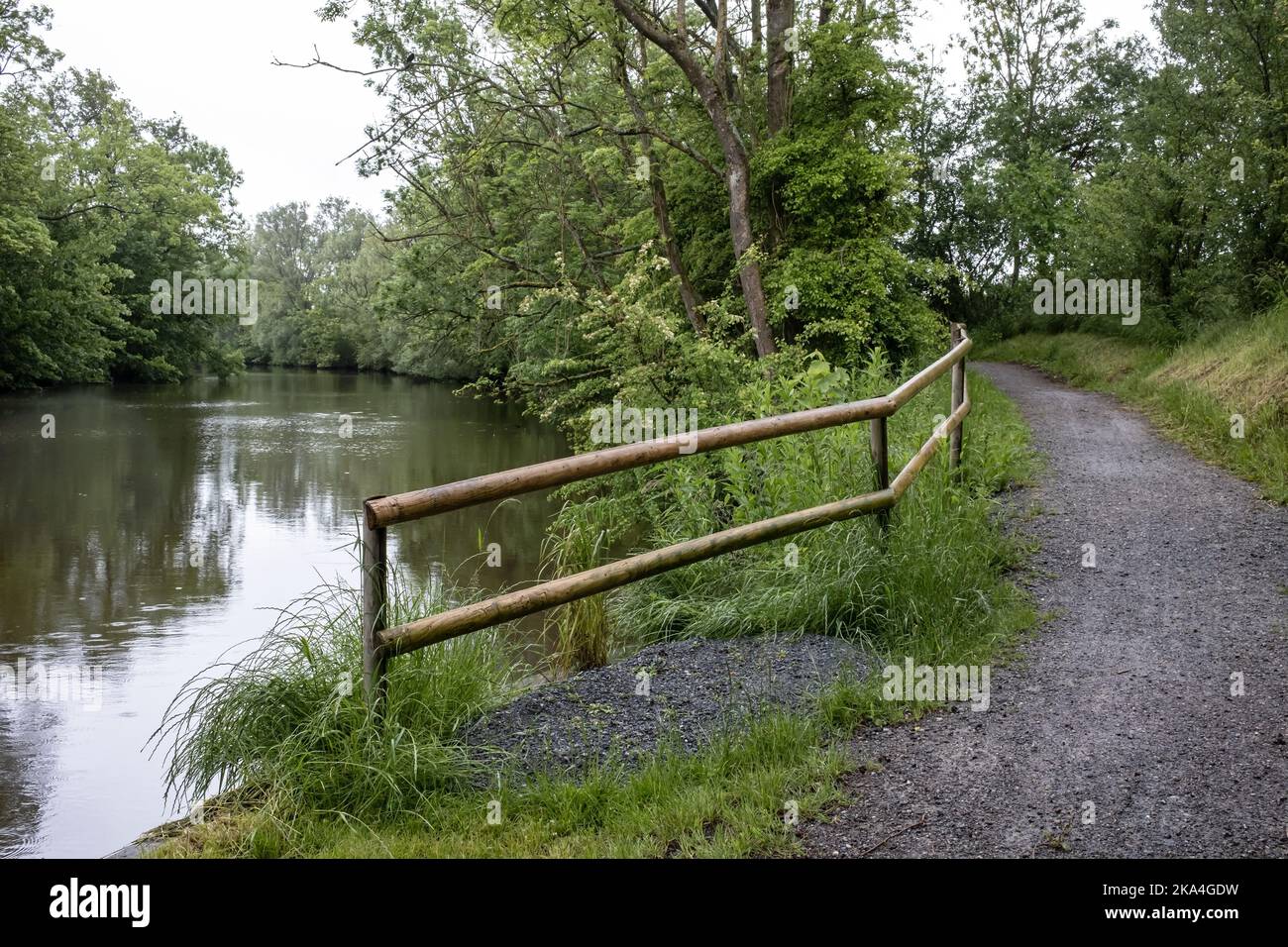 Path for walking and cycling, with wooden railings to prevent falling ...