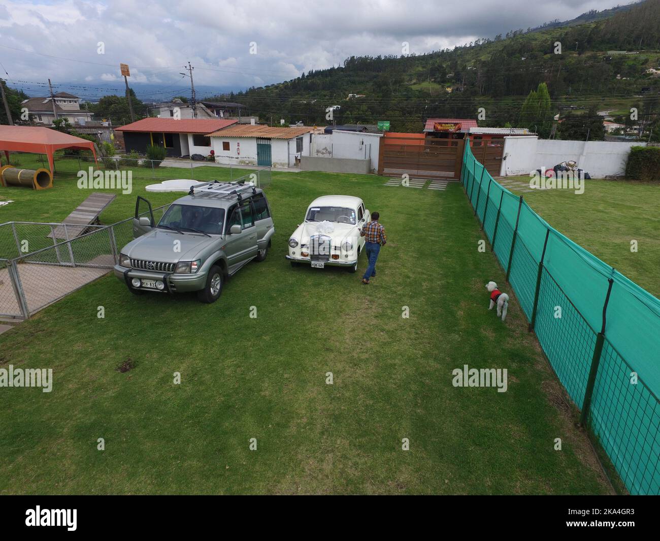 A summer house with a green playground, pool and spacious parking Stock ...
