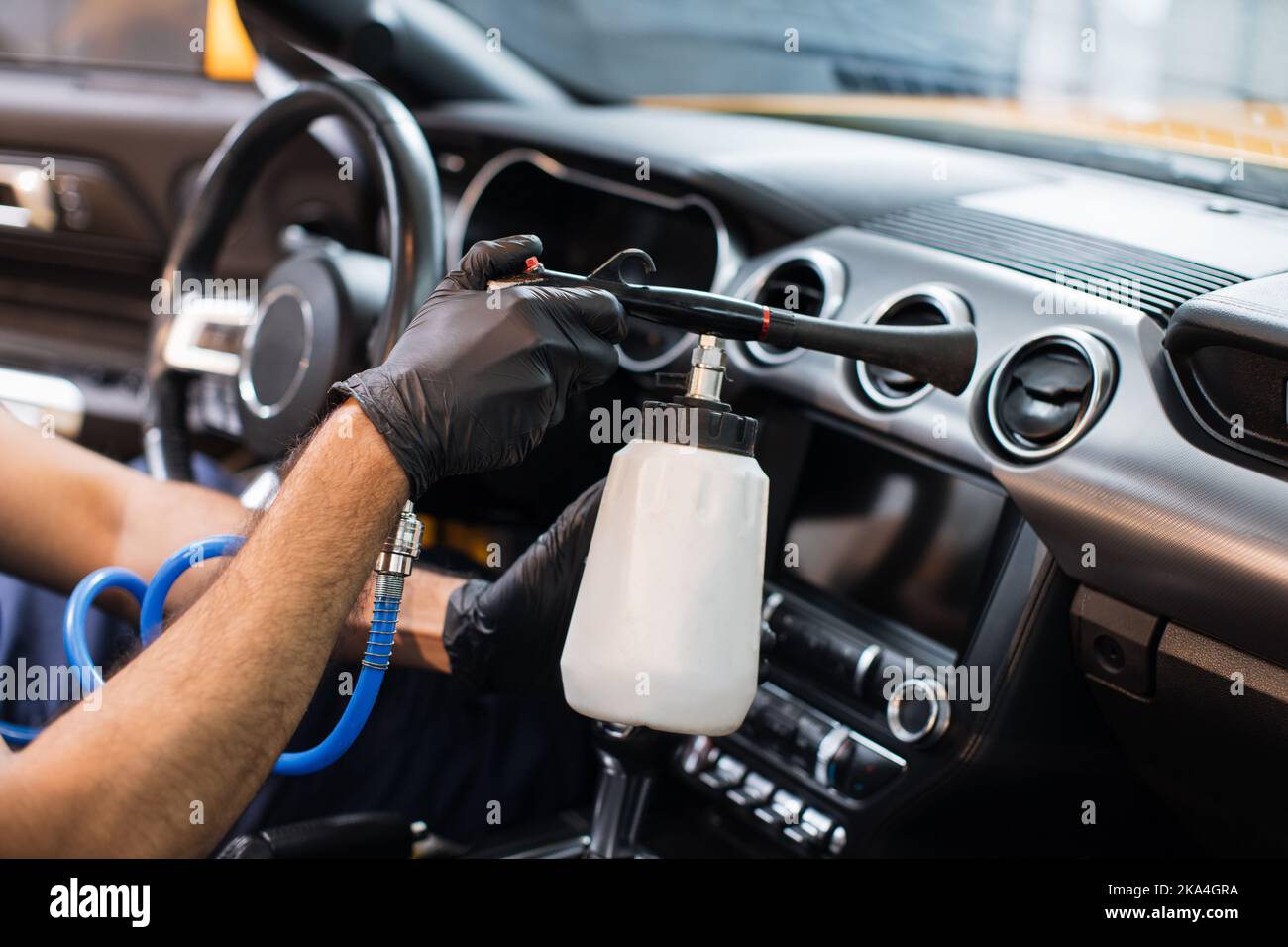 Car wash service. Close up of hands of male worker cleaning automobile ...