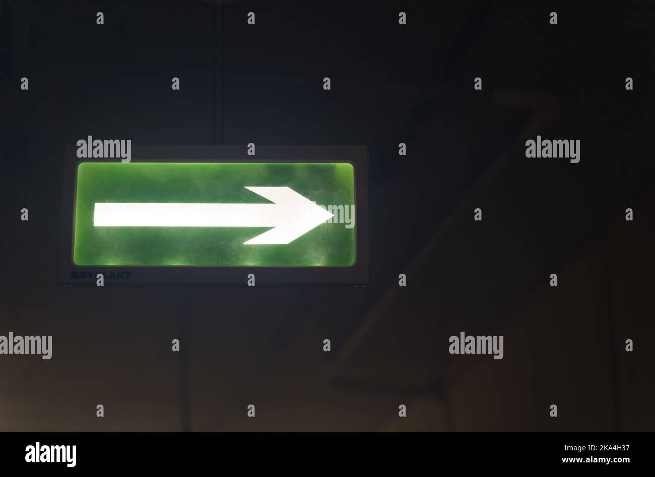 Glowing board, emergency exit sign in the building. Security concept ...
