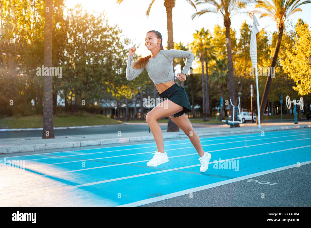 Female athlete start to run. Fit confident woman starting running with ...