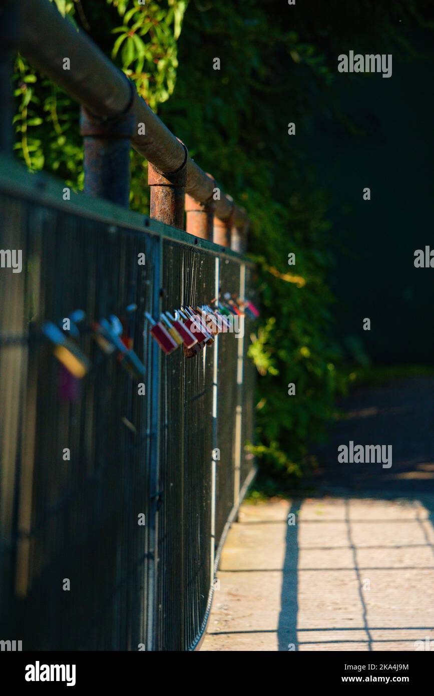 A vertical shot of colorful lockers on a bridge Stock Photo - Alamy