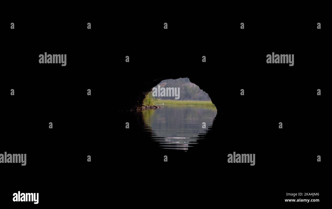 A tunnel passage opening in Caddy lake, Manitoba in spring Stock Photo ...