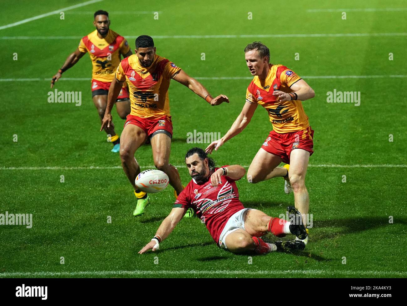 Wales' Rhys Williams (centre) defends against Papua New Guinea's ...