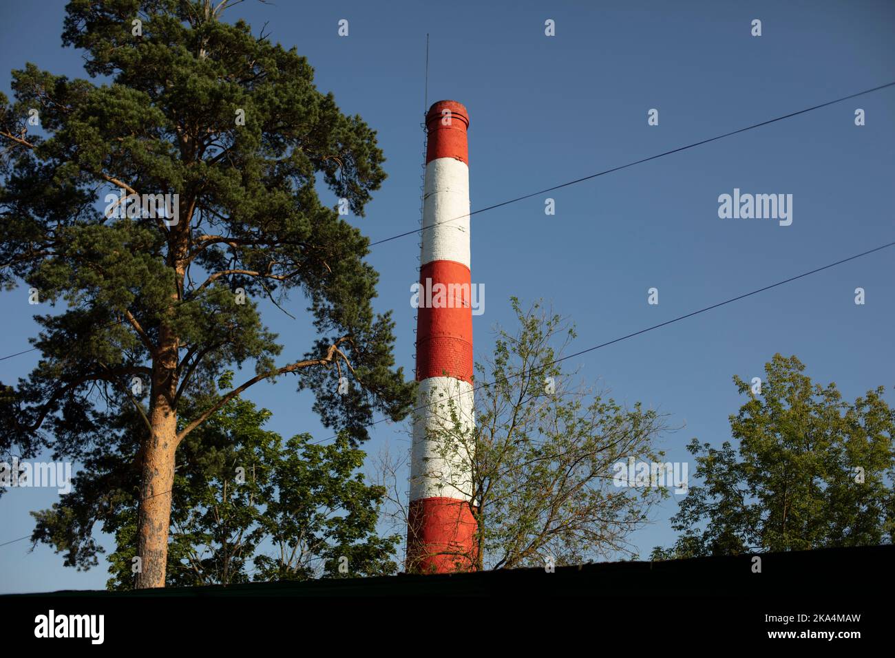 Red industrial pipe. Pipe factory. Details of industrial facility ...