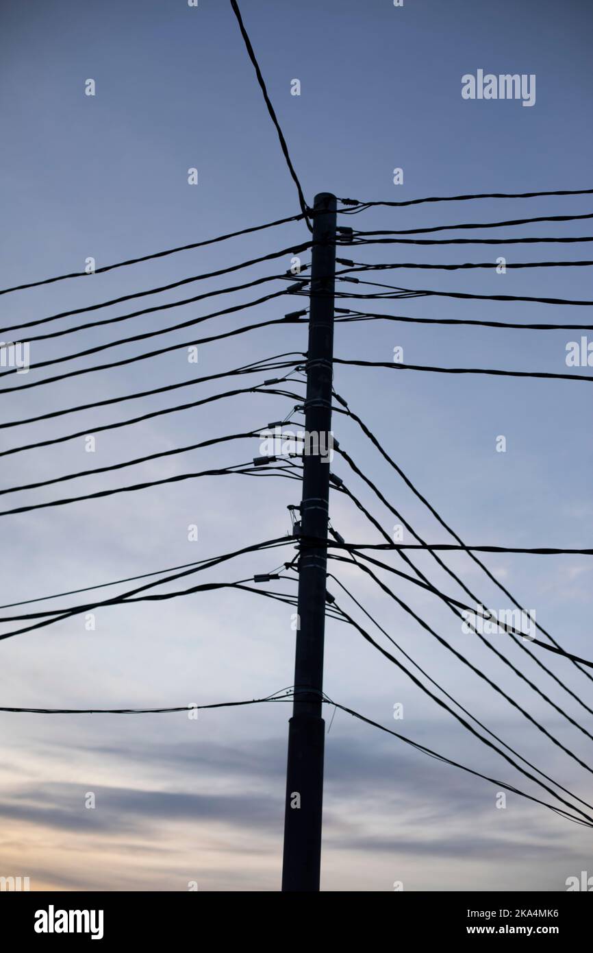 Electrical wires on pole. Many wires against sky. High voltage pole ...