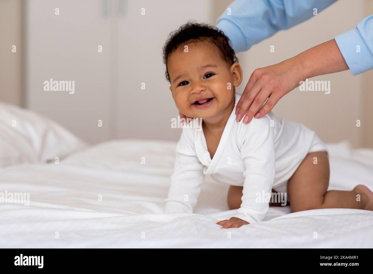 Adorable Black Baby Getting Massage From Loving Mom While Relaxing On ...