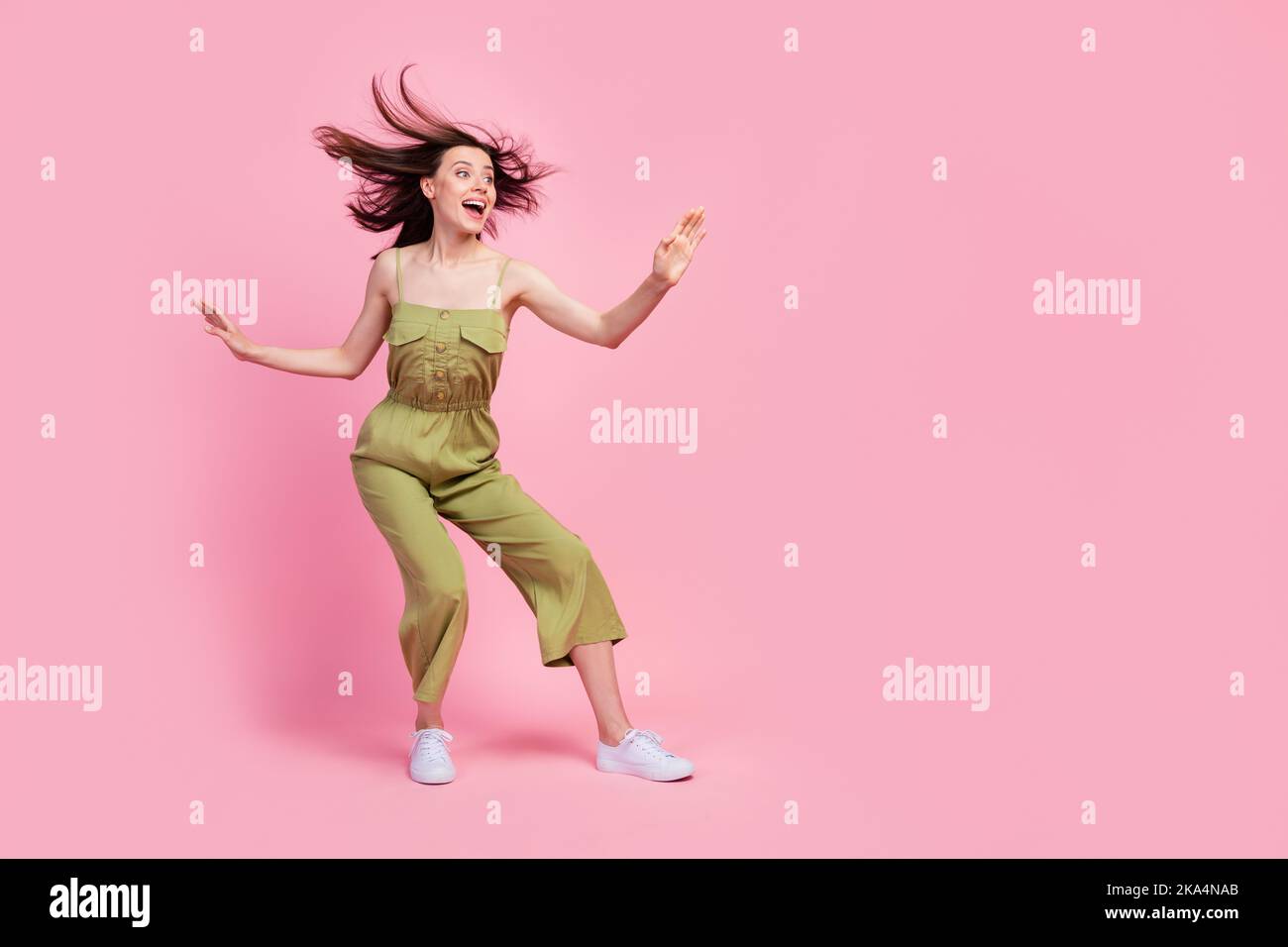 Full length photo of cheerful girl energetic active person look empty ...