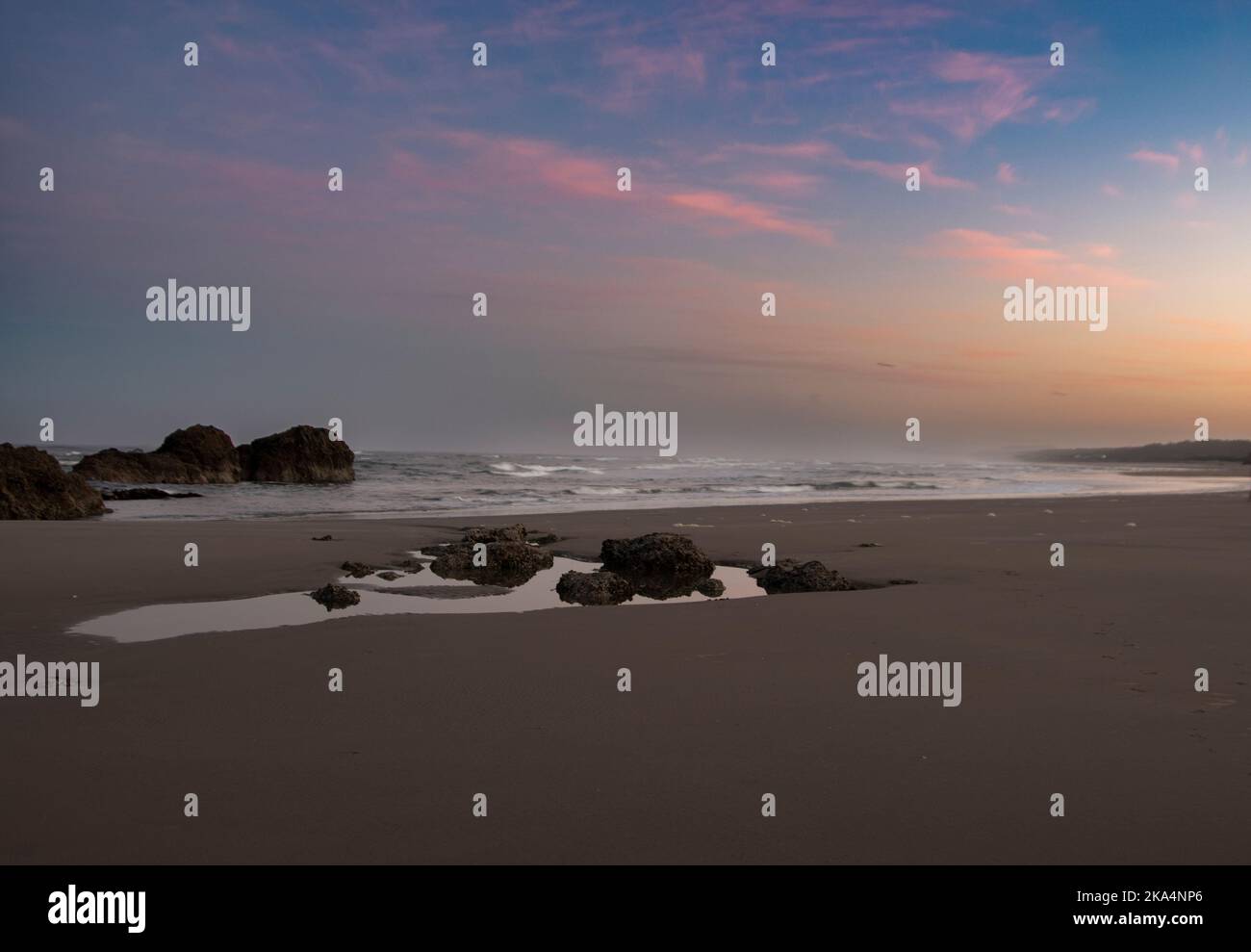 Sunrise or Sunset over the Oregon Coastline, with waves washing over ...
