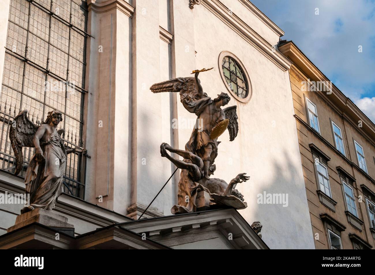 Archangel Michael slaying Lucifer on the pediement entrance of St ...