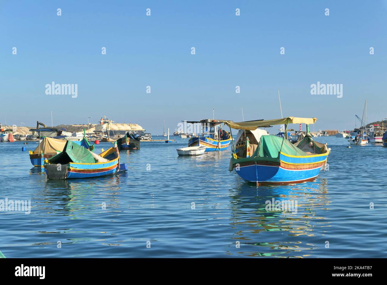 Traditional colorful fishing luzzu boats in Malta harbor in Marsaxlokk ...