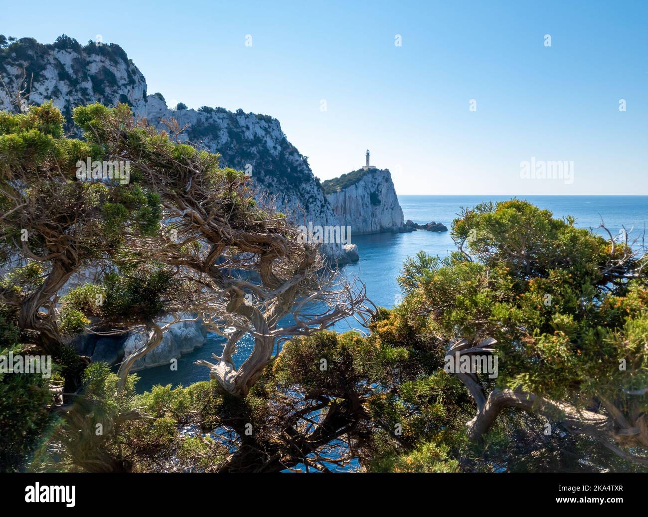 Distance view of a lighthouse built on a cliff top on the cape of an ...