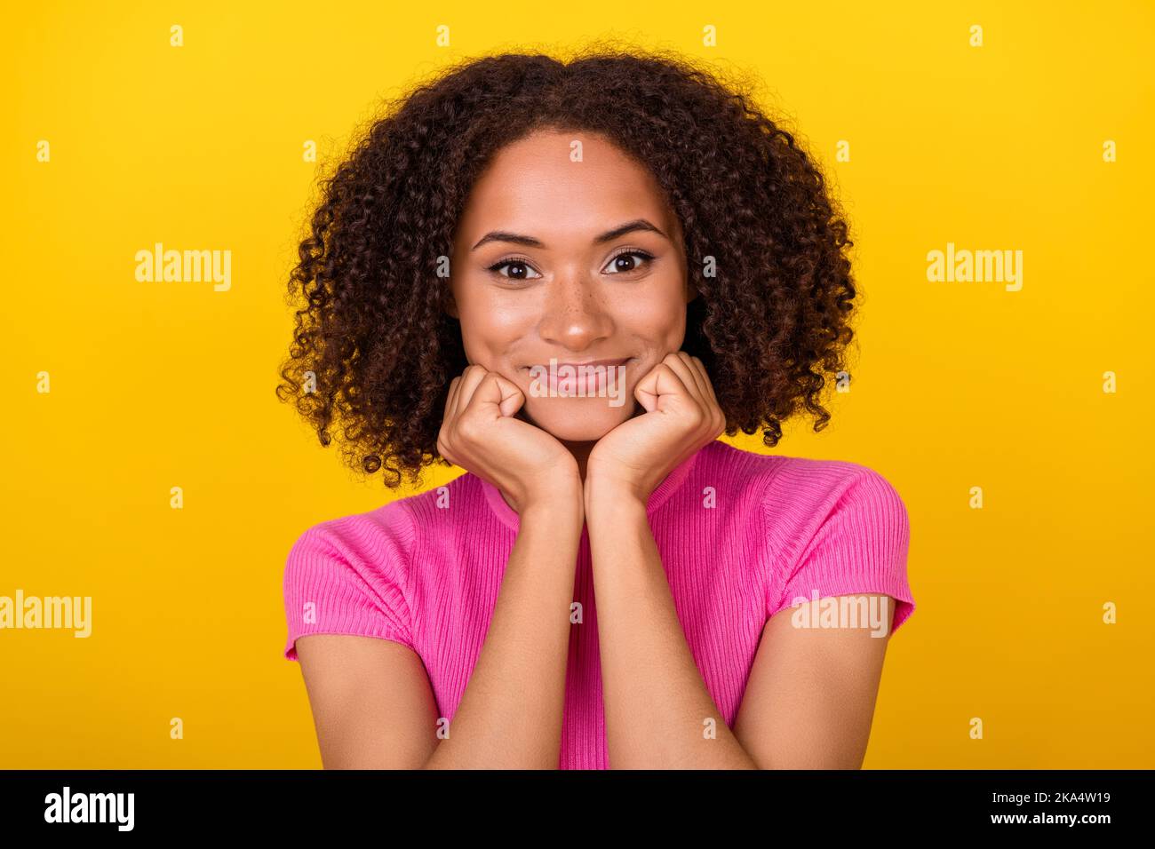 Portrait of charming positive person hands touch cheeks nice wavy ...