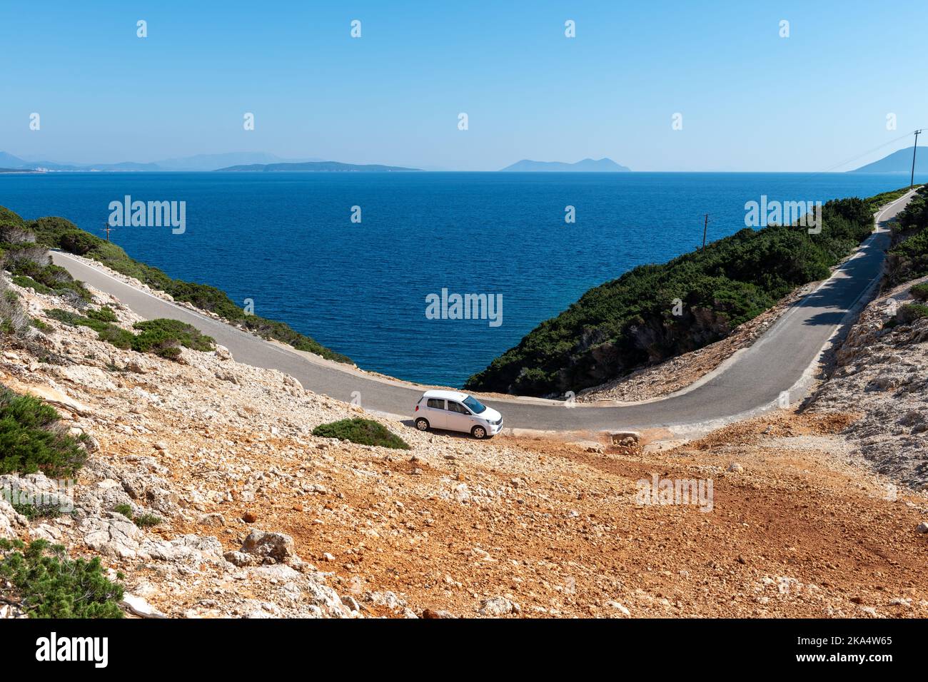 Lefkada island. Greece- 10.21.2022. A car on a bendy empty road. Drive ...