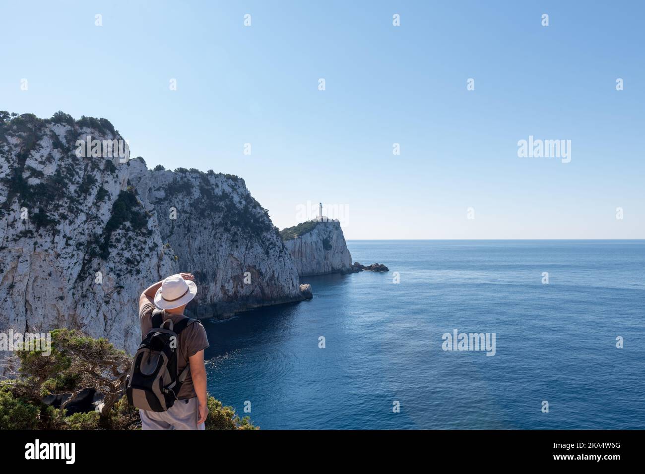 Distance view of a lighthouse built on a cliff top on the cape of an ...