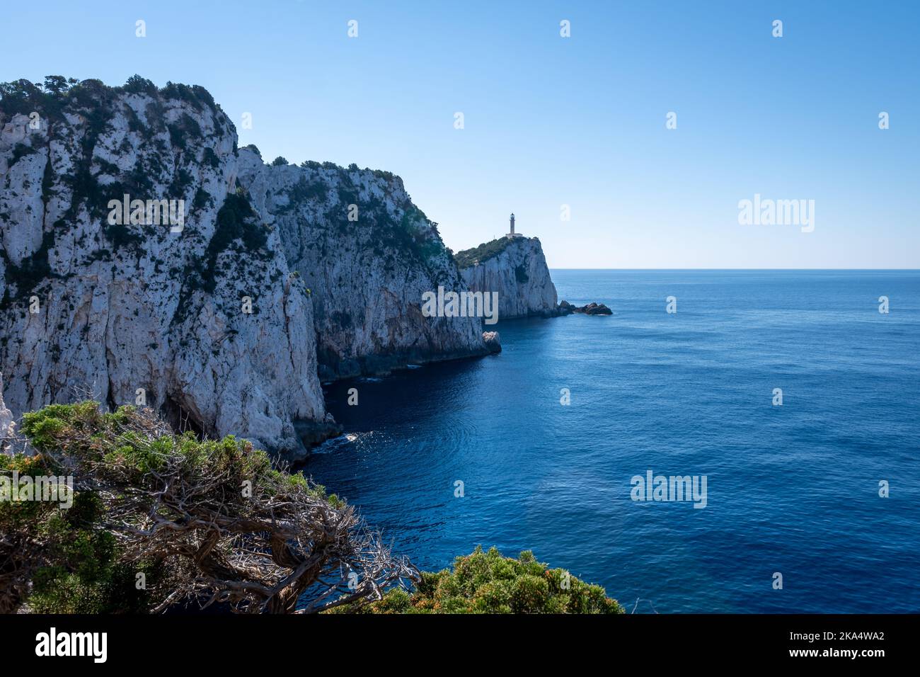 Distance view of a lighthouse built on a cliff top on the cape of an ...