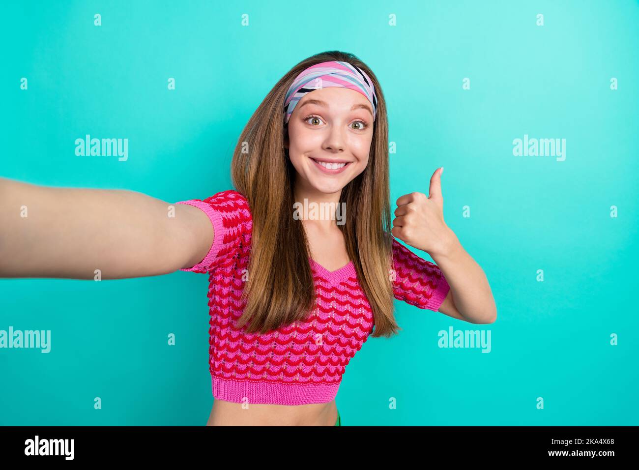 Photo of sweet funny school girl dressed pink crop top recording video ...