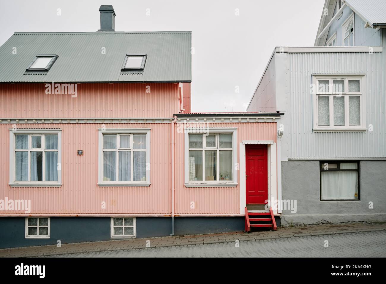 Low rise colorful houses on street Stock Photo - Alamy