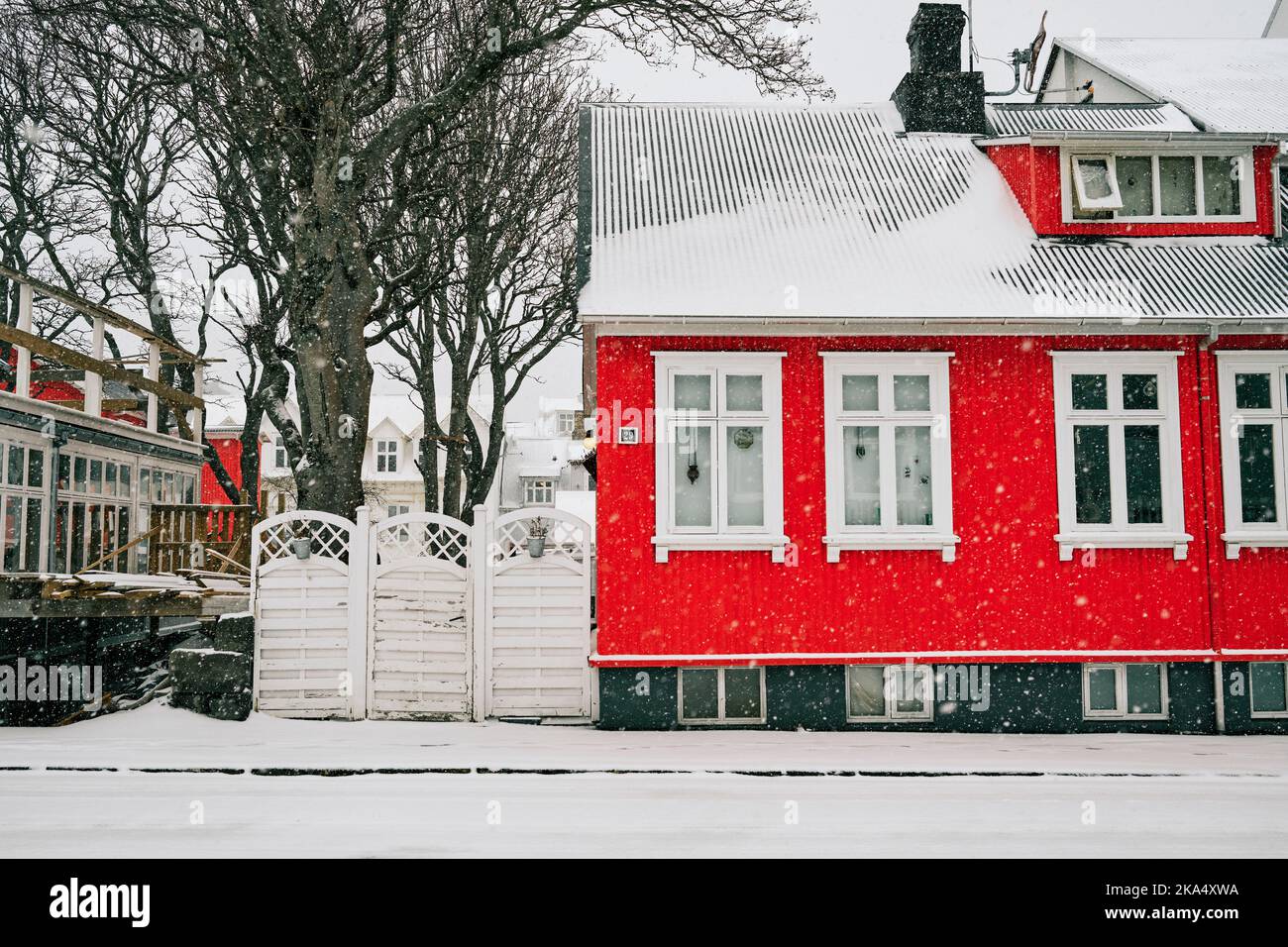 Exterior of red house in winter Stock Photo - Alamy
