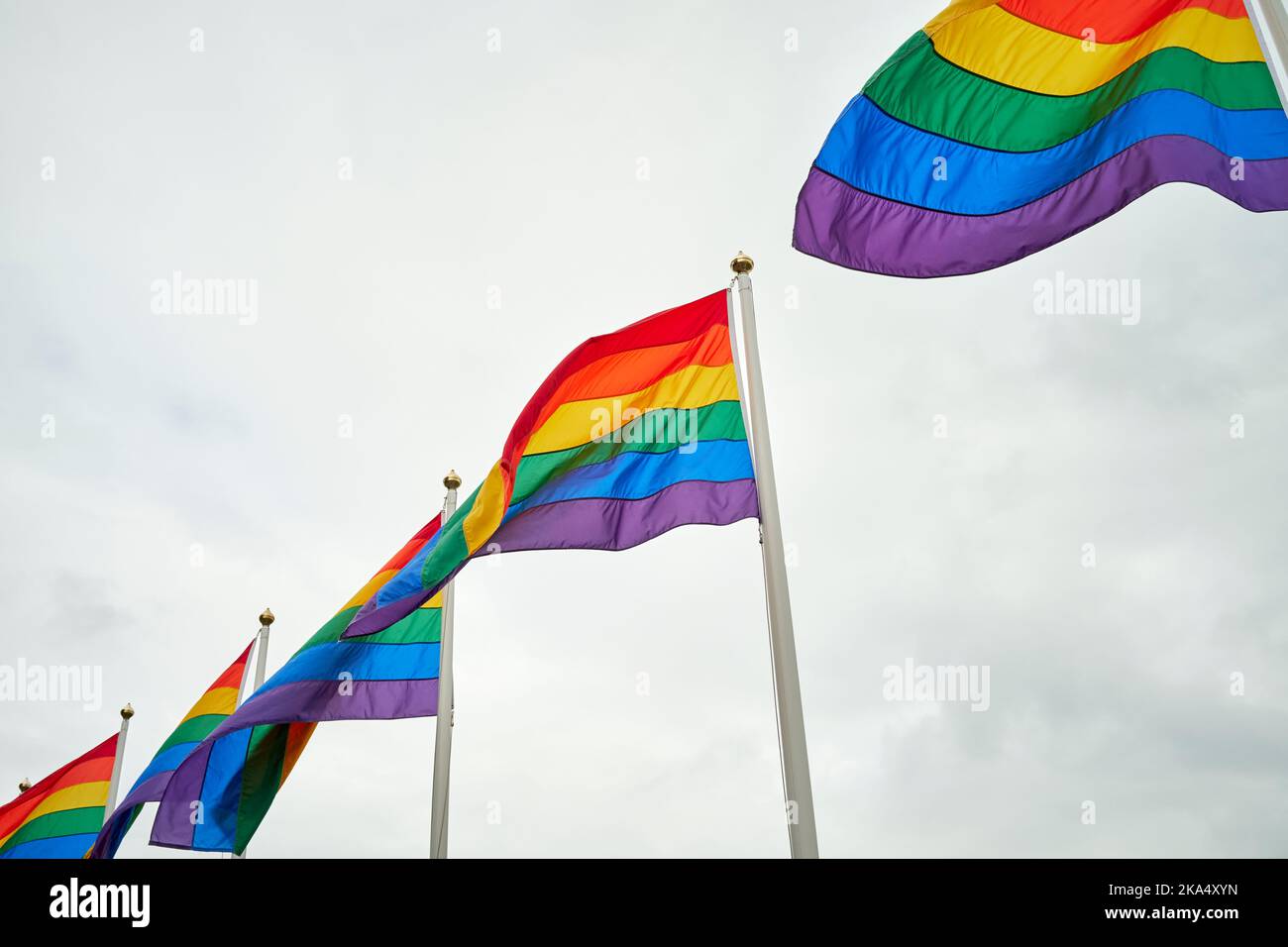 Rainbow flag against the sky hi-res stock photography and images - Alamy