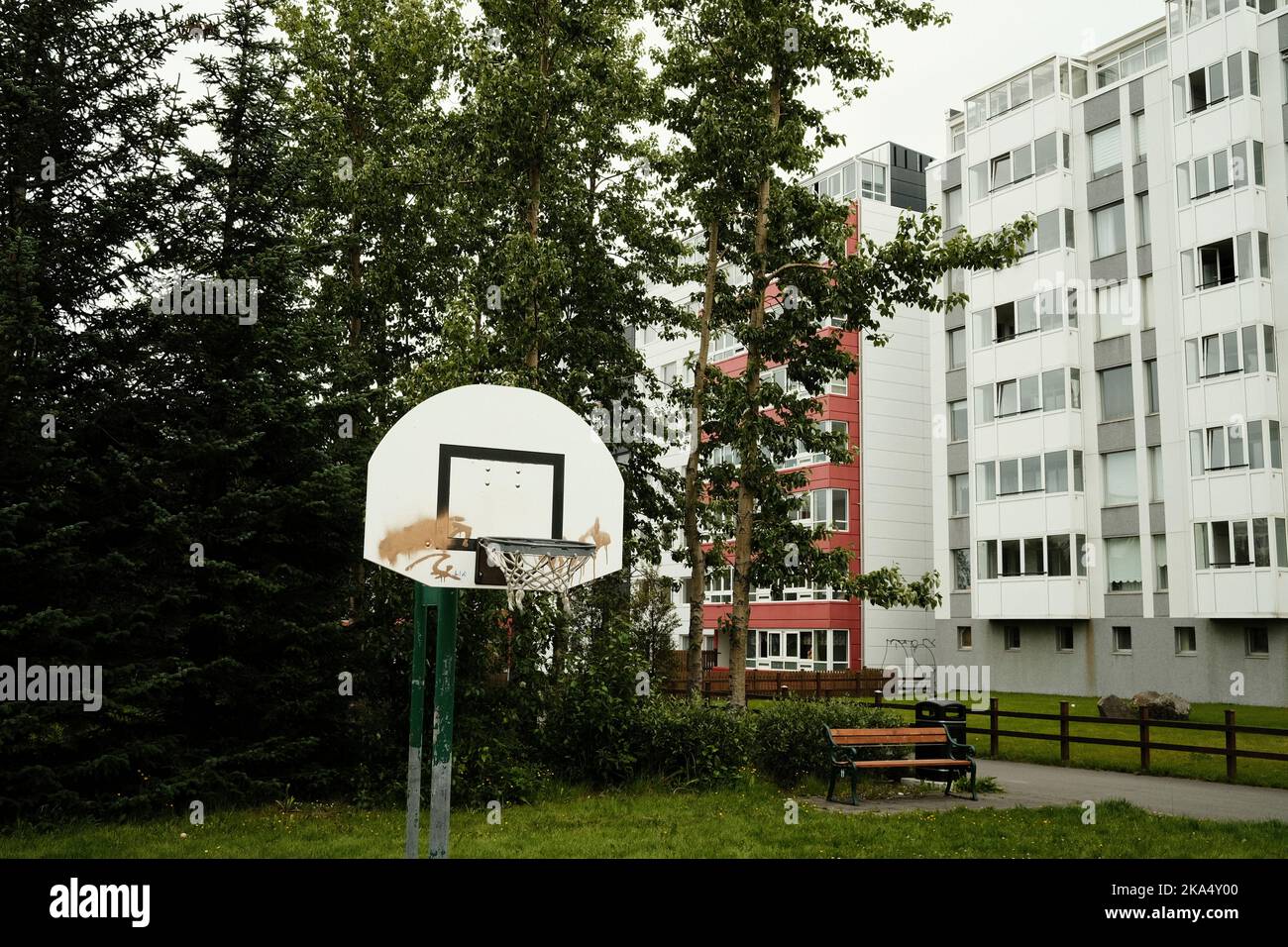 Basketball hoop in backyard of residential building Stock Photo - Alamy