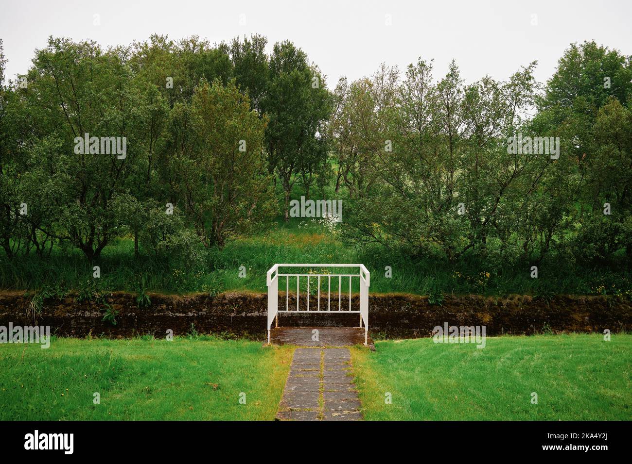 Fence near river in nature Stock Photo - Alamy