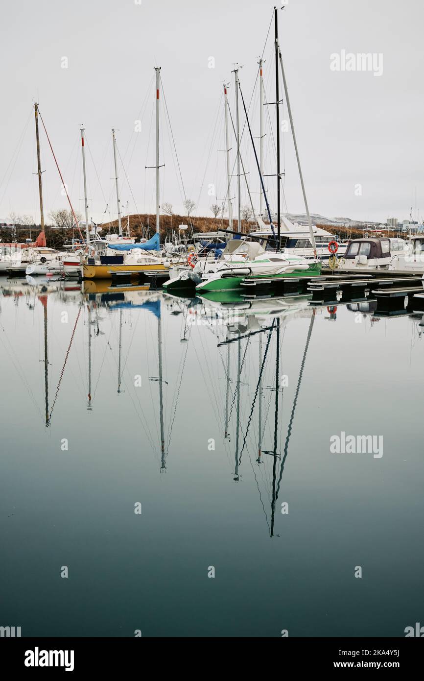 Port with moored boats on still river water Stock Photo - Alamy