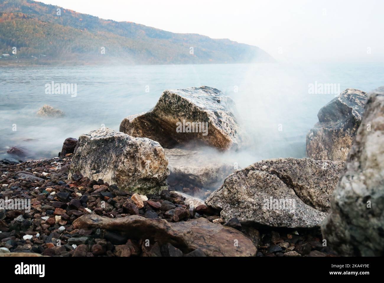 The waves of Lake Baikal break on the coastal rocks Stock Photo - Alamy