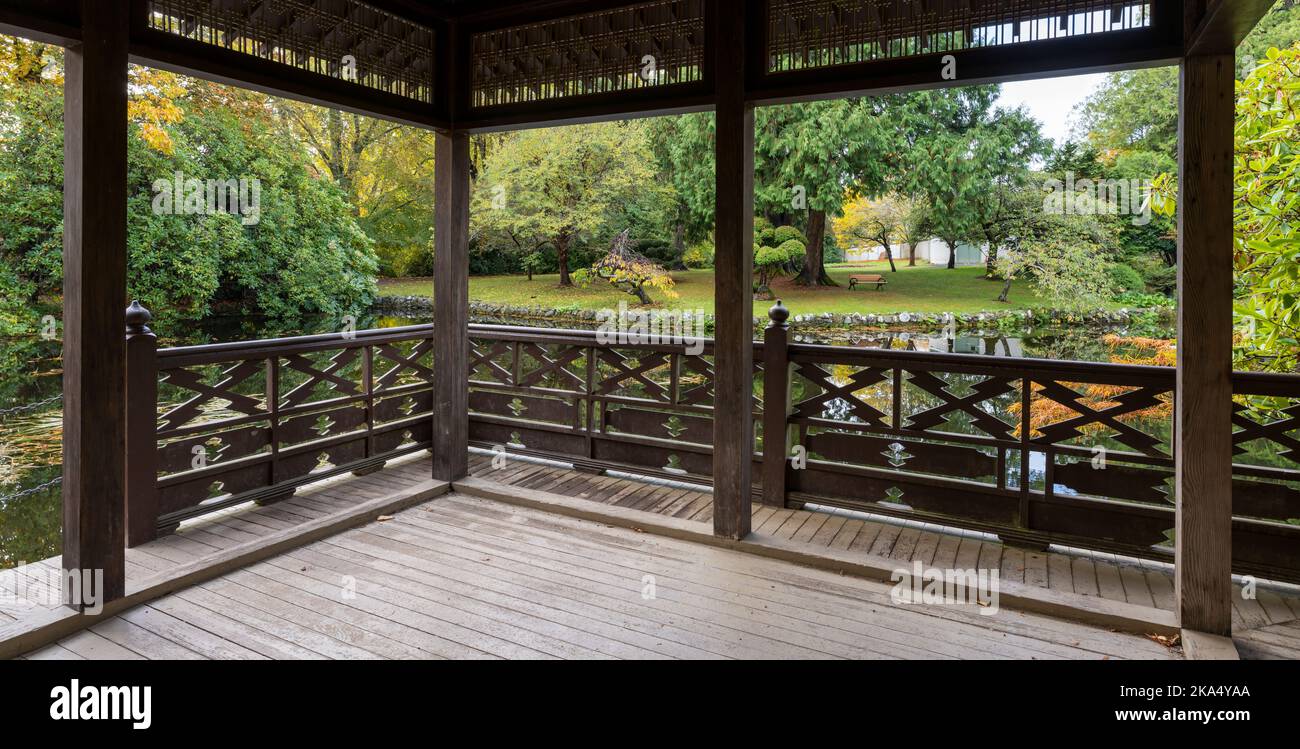 A viewing pavilion at a pond in the Japanese garden at Hatley Park ...
