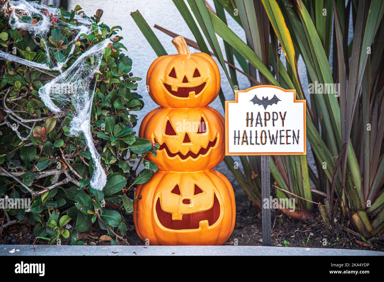 A group of three Jack O' Lanterns stacked as to look like a Snow Man ...
