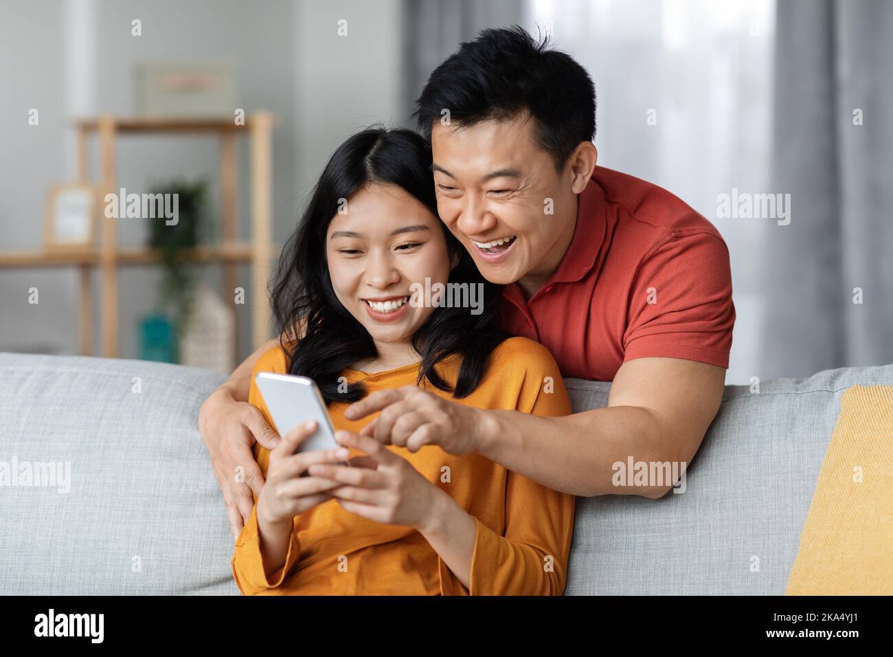 Happy chinese man smiling using hi-res stock photography and images - Alamy