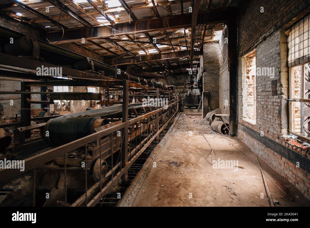 Old broken empty abandoned factory with rusty machines Stock Photo - Alamy