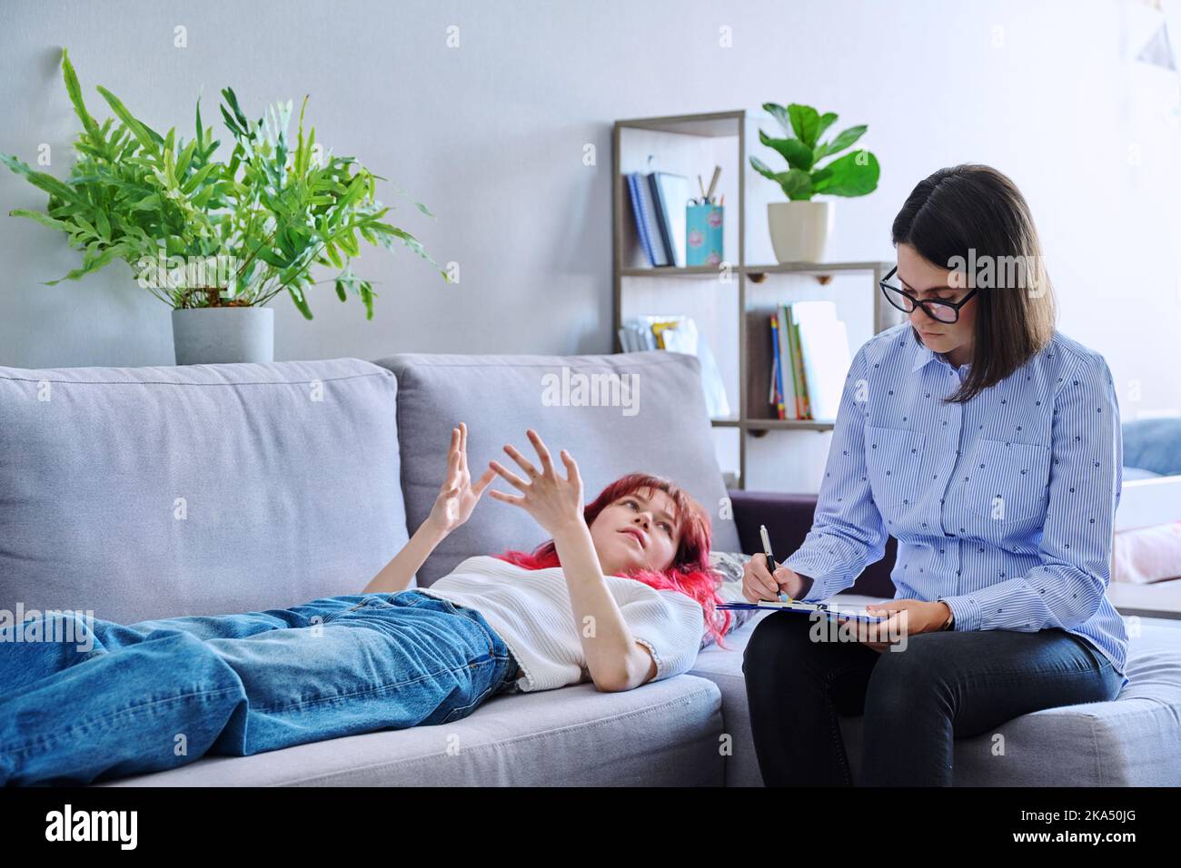 Session therapy of teenage student girl with counseling psychologist ...