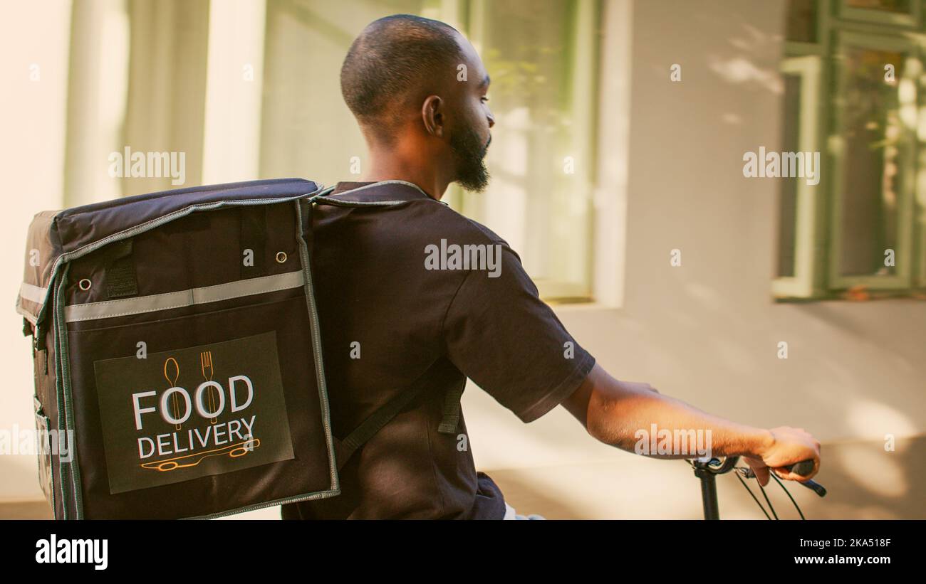Black delivery man door bell hi-res stock photography and images - Alamy