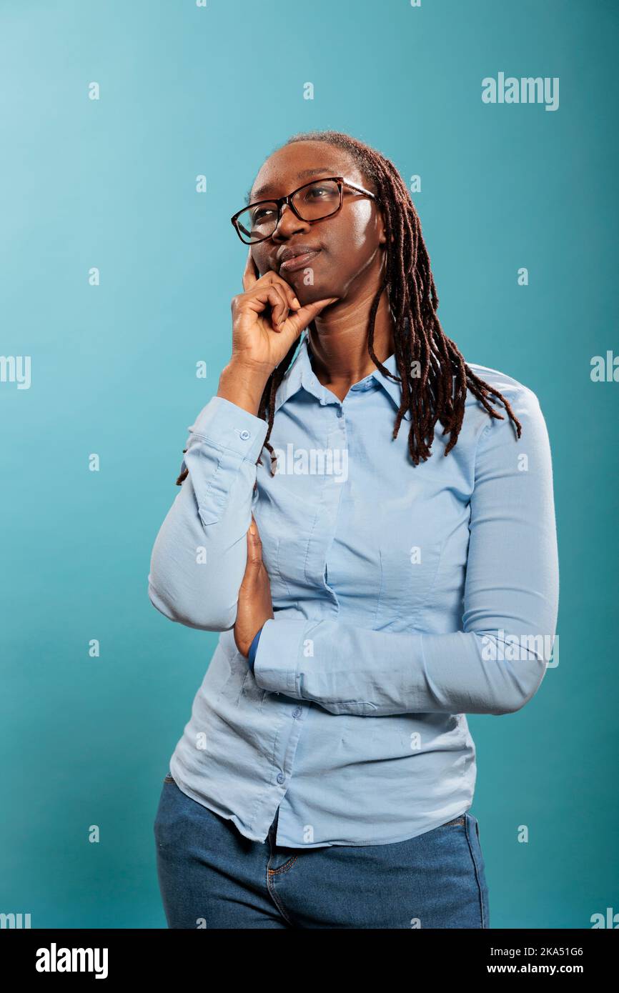 Pensive thoughtful african american woman being meditative and ...