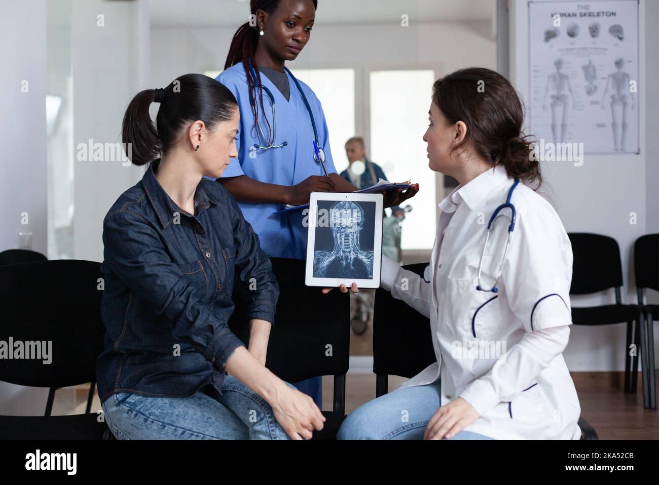 African american doctor discussing with general practitioner young ...