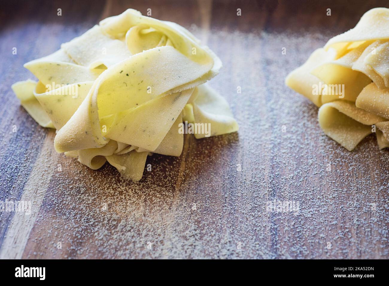 Freshly made pasta on a wooden background Stock Photo - Alamy