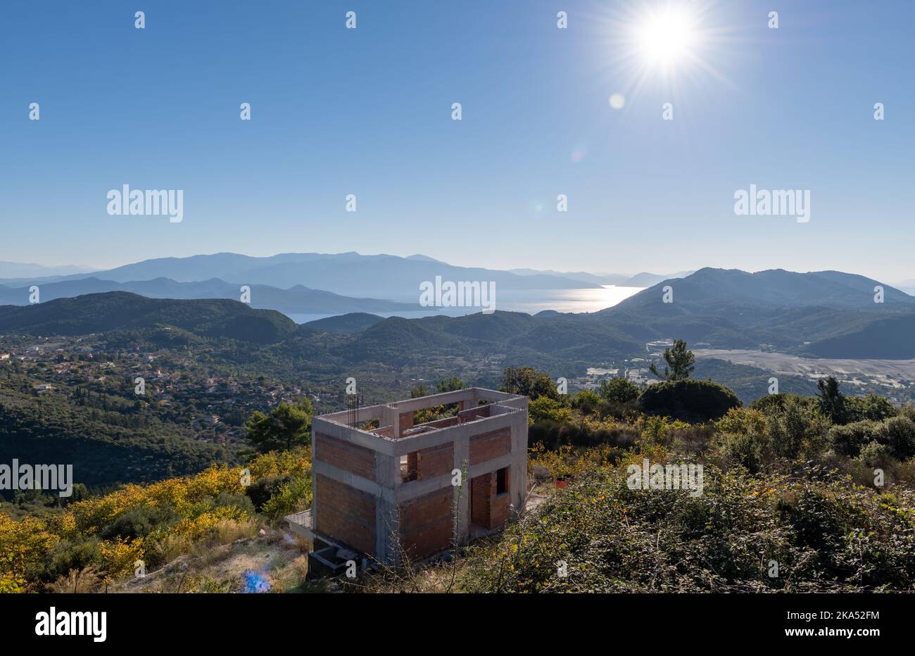 A house under construction on a mountain side with stunning panoramic ...