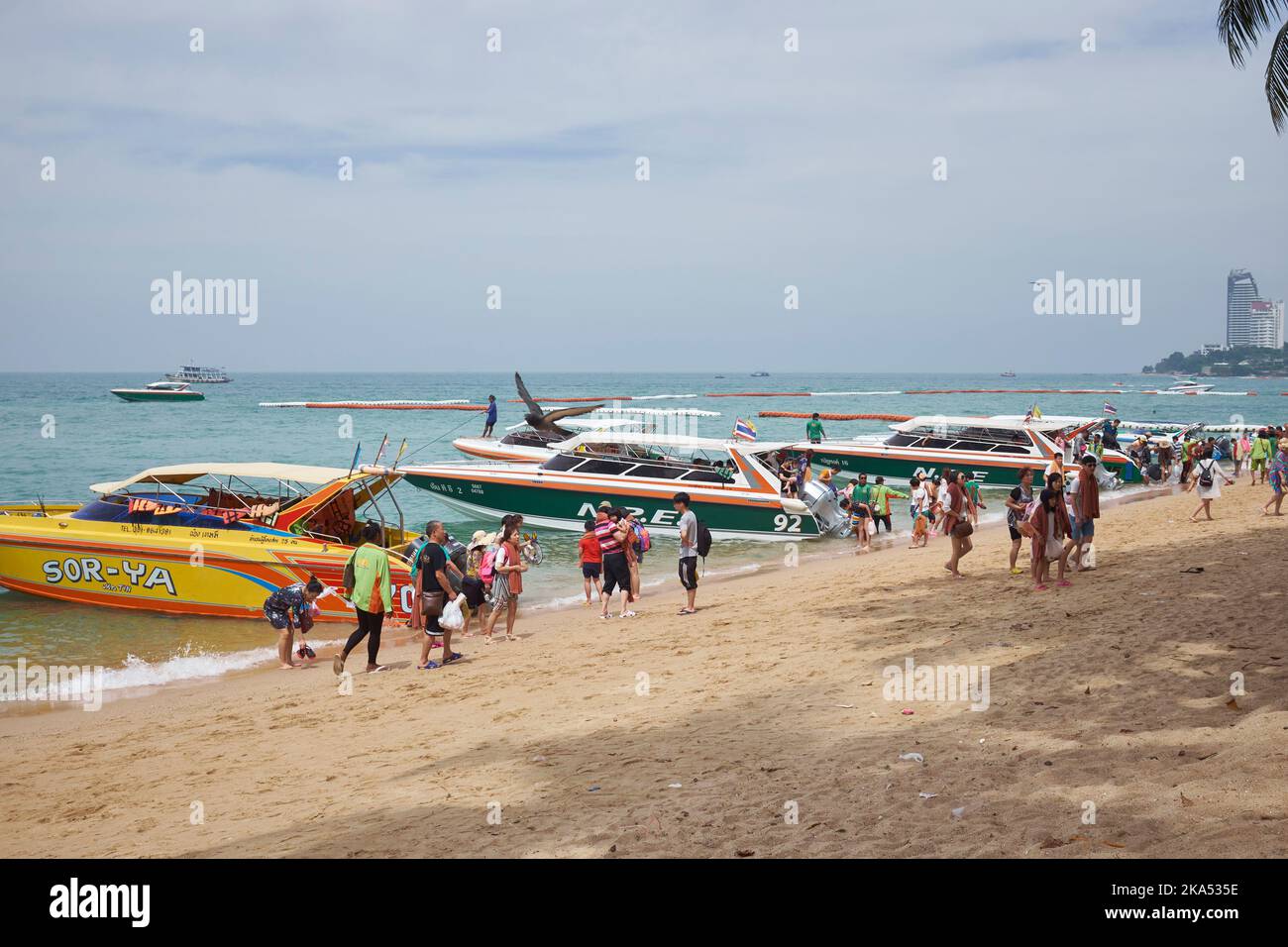 Tour Boats on the Beach at Pattaya Thailand Stock Photo - Alamy