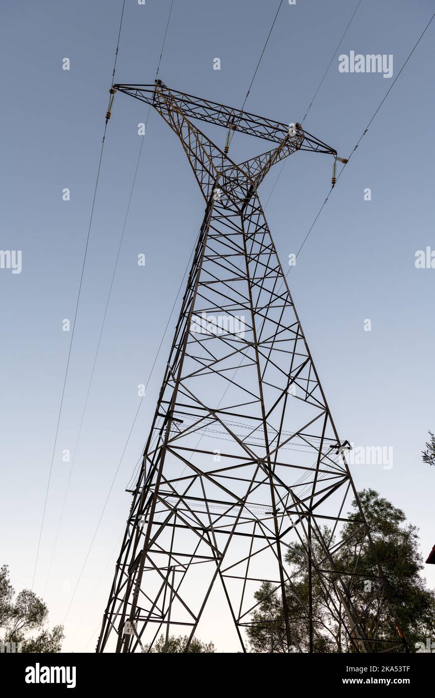 A view of a electricity transmission tower from the base looking upward ...