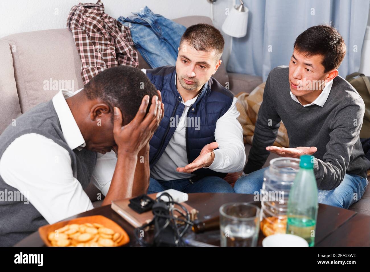 Two friends are talking about life and supporting sad man Stock Photo ...