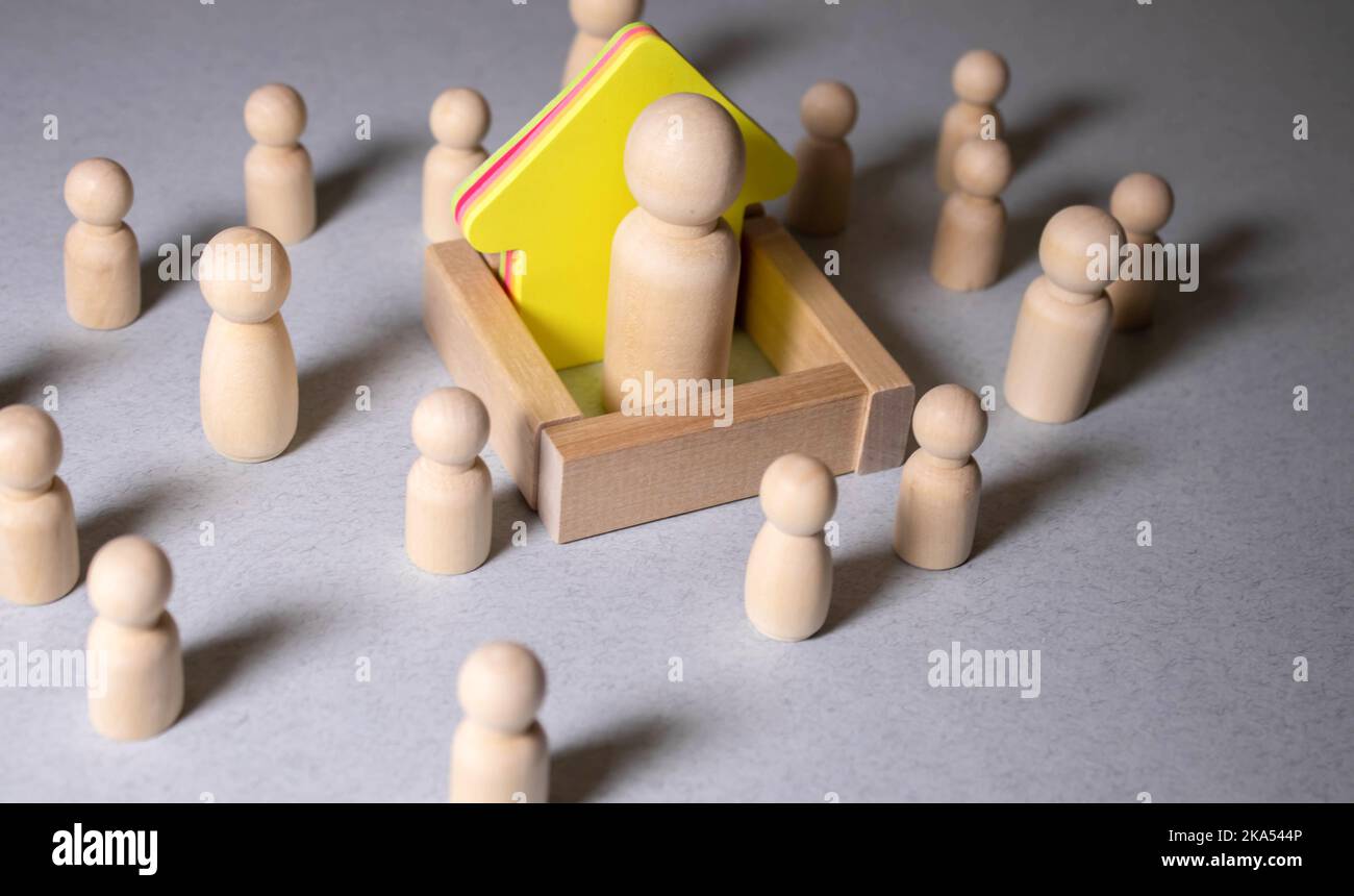 Person isolating in solitude separated behind a wall concept for being ...