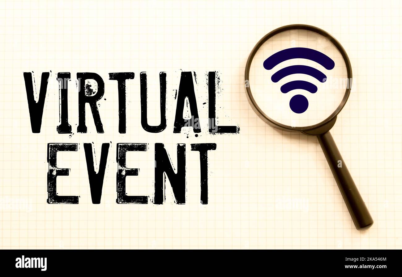 VIRTUAL EVENT. text on sticker on bright green background. near paper ...