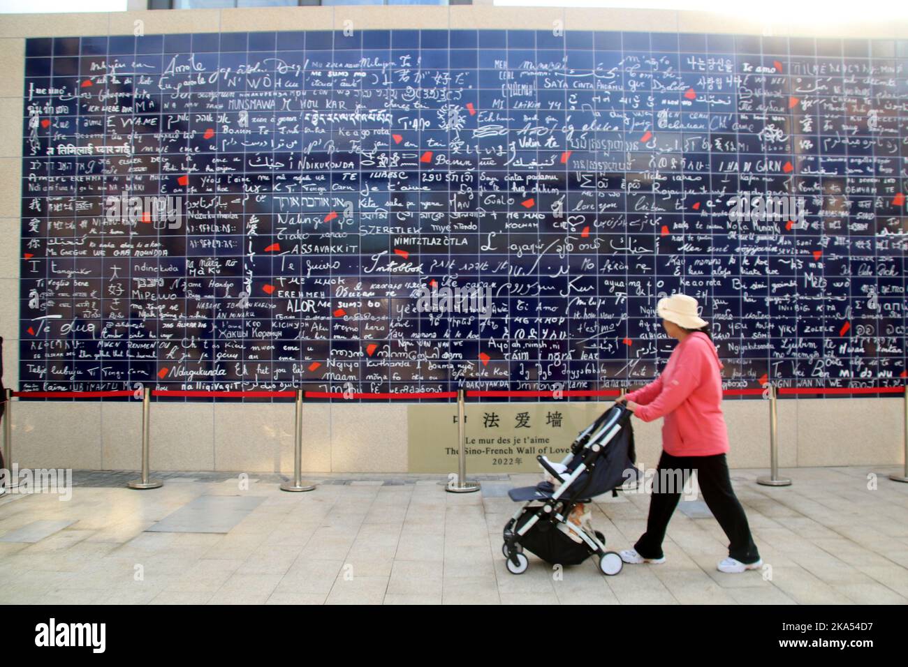 SUZHOU, CHINA - OCTOBER 31, 2022 - Citizens view and pose for photos next to the French Love ...