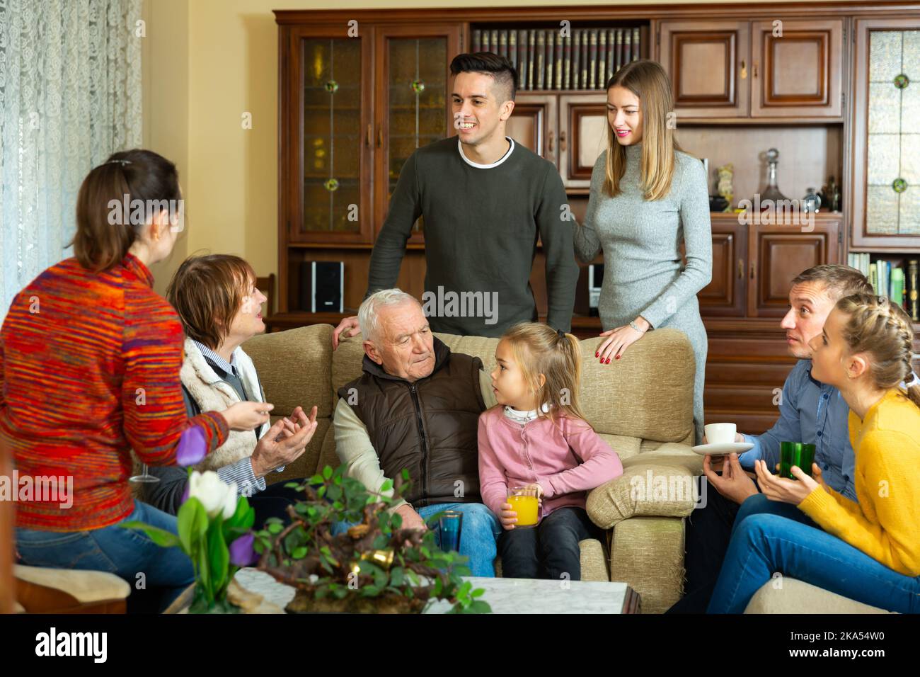 Big family together at home Stock Photo - Alamy
